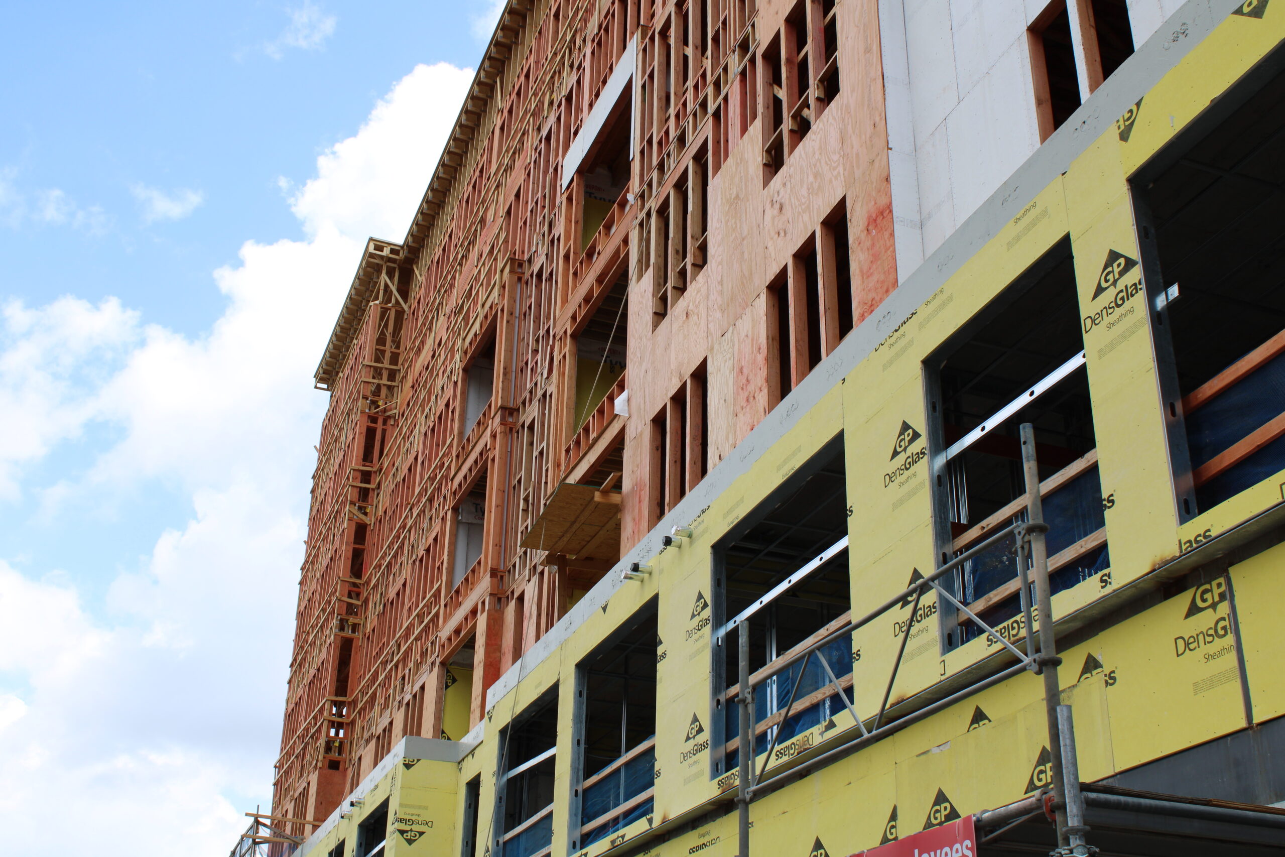 North Graham Street apartment complex celebrates construction milestone ...